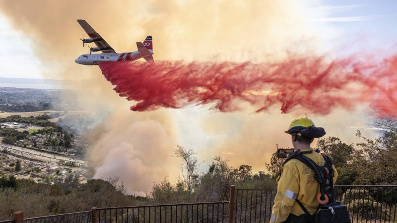Fast-moving California wildfire destroys dozens of homes, forces ...
