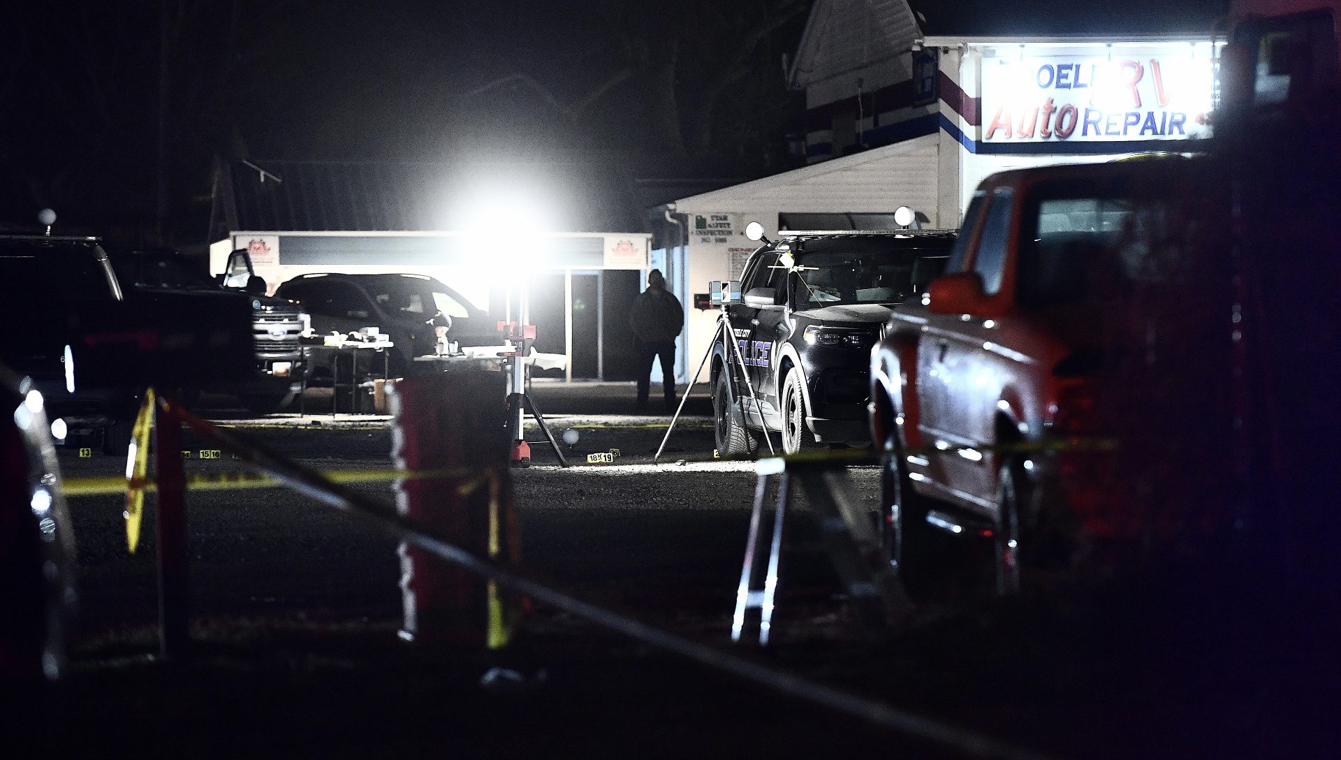 State law enforcement investigators work into the night at site of ...